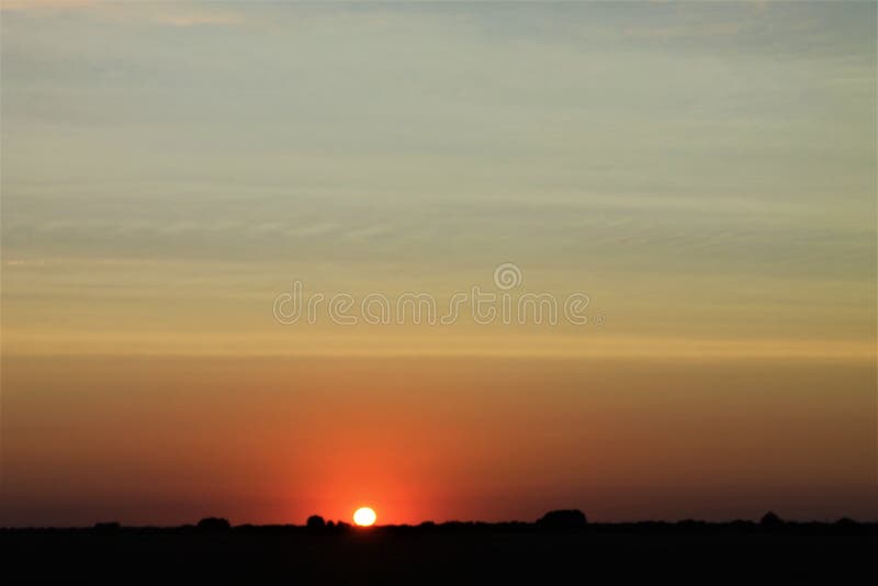 Red round sun stock image. Image of evening, sunlight - 200705865