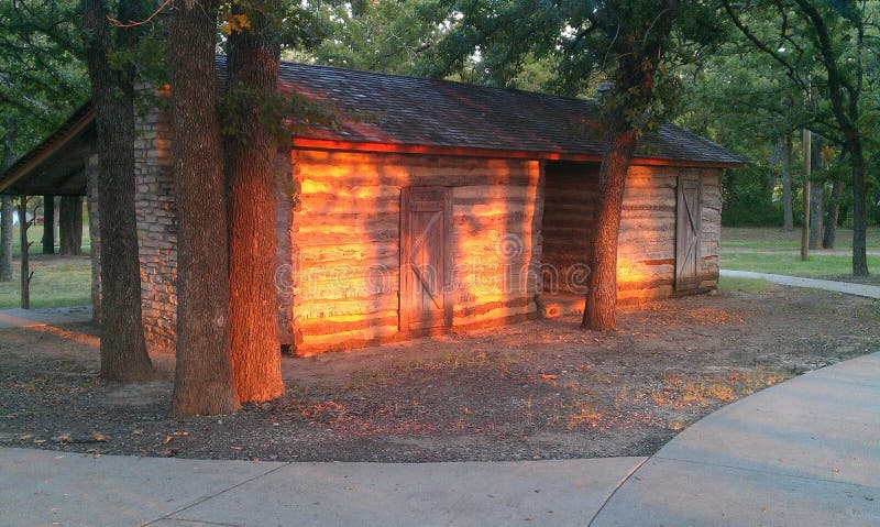 Sun setting on a log Cabin stock photo. Image of cabin - 83290688
