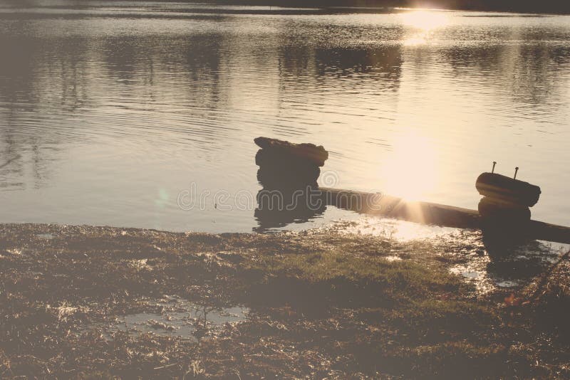 Sunset on Log in Lake stock photo. Image of sunset, beautiful - 69598800