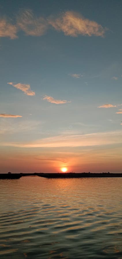 The sunset on losari beach stock photo. Image of morning - 199075376