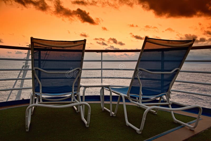 Sunset from Lounge Chairs stock image. Image of pair - 13538121