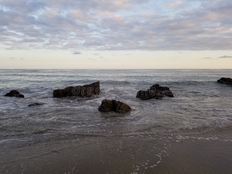 Water Colliding with Immovable Rocks Stock Photo - Image of malibu ...