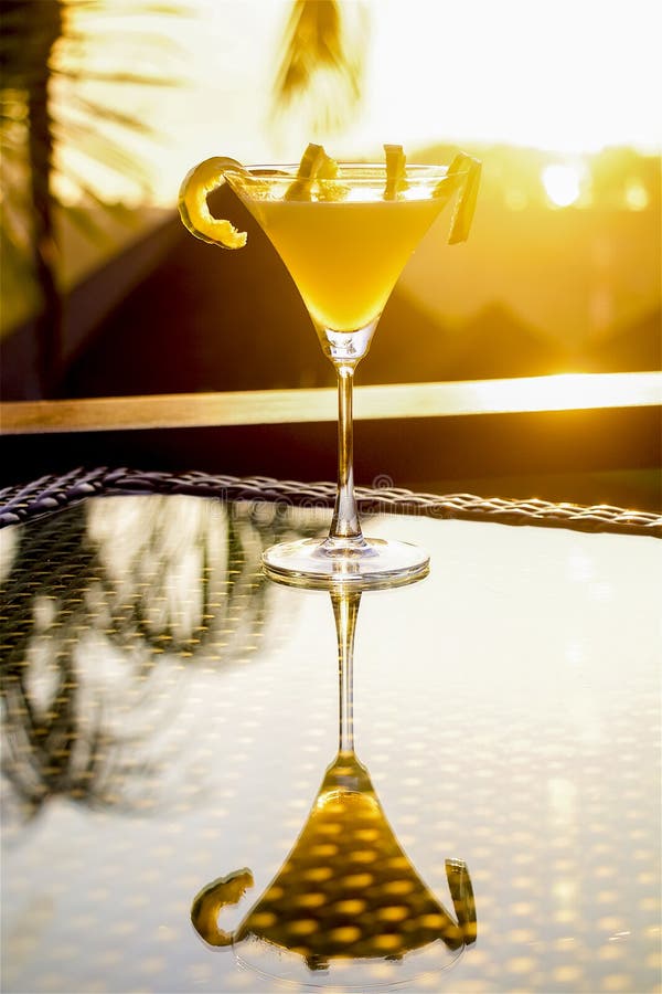 Sunset martini cocktail stock image. Image of glasstop - 98072467