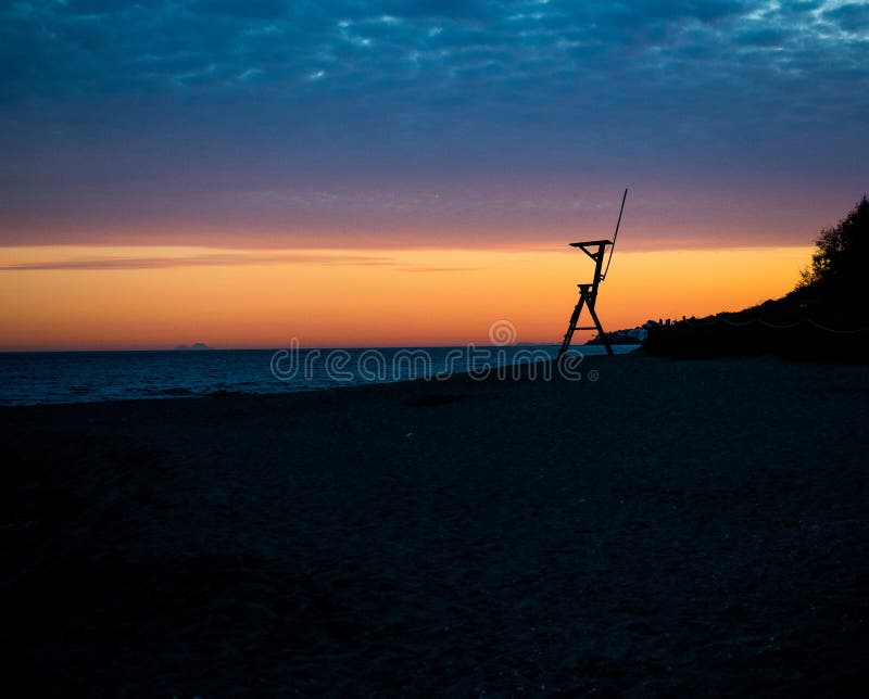 Sunset on a Beach, Next To a Coastal Surveillance Post Stock Image ...