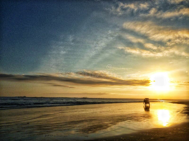 Sunset in the Middle of the Beach Stock Photo - Image of beach ...