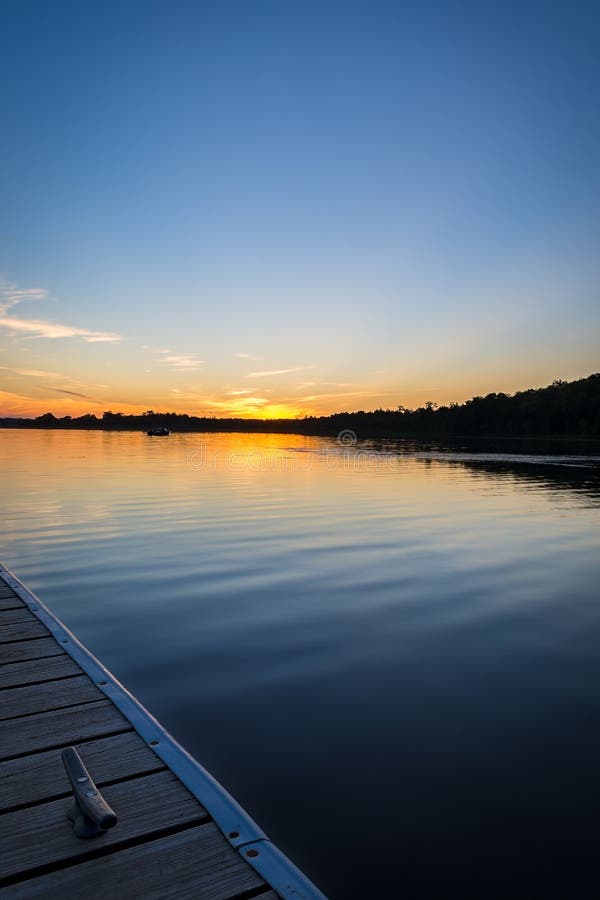 Sunset on a Minnesota lake stock photo. Image of clouds - 97991206