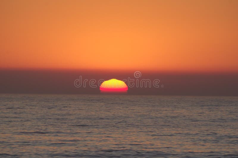 Sunset Mirage Over the Water Stock Photo - Image of oceanscape ...