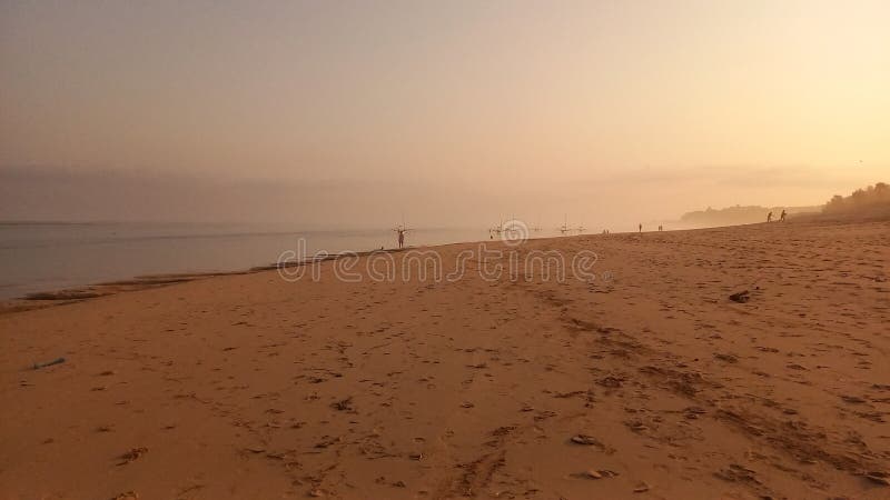 Sunset misty beach stock photo. Image of bali, sunset - 296666868