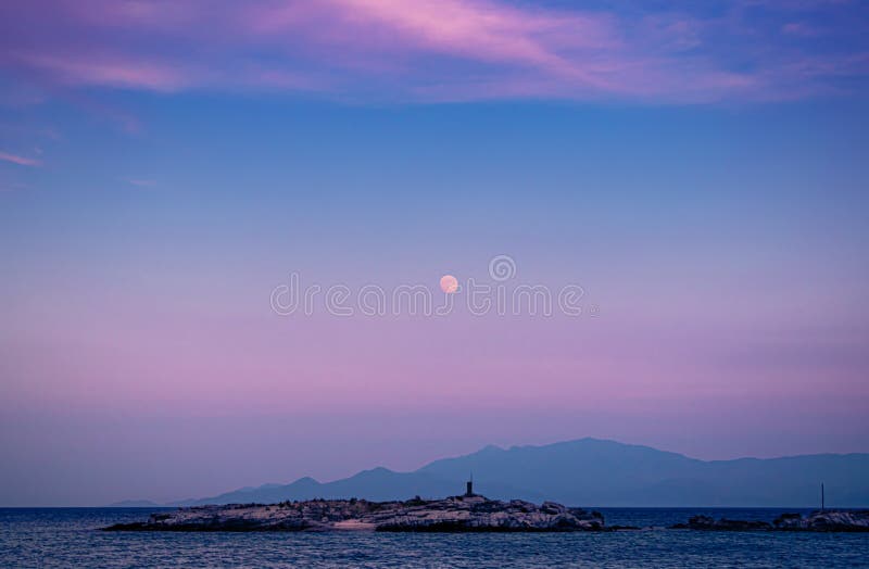 Sunset and Moonrise at the Same Time Stock Image - Image of water ...