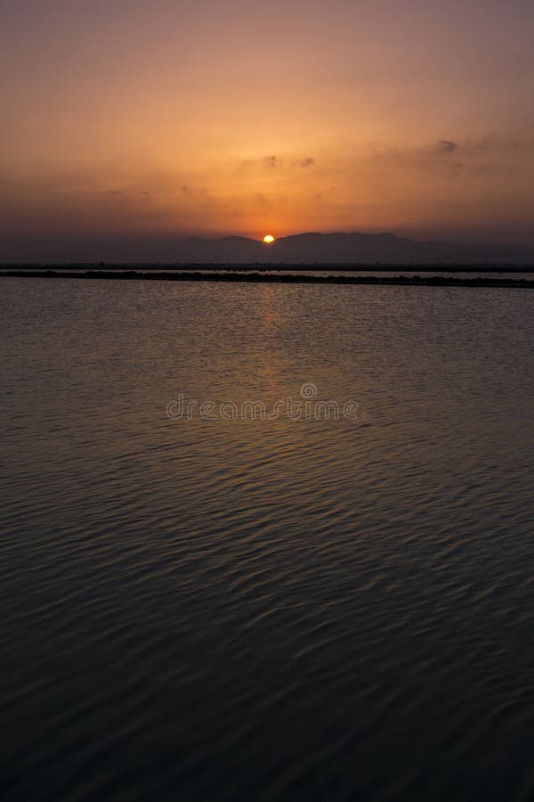 Sunset between Mountains and Lake Stock Image - Image of sunset, orange ...