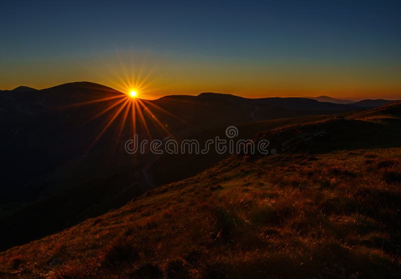 Sunset in the mountains stock image. Image of idyllic - 159151331