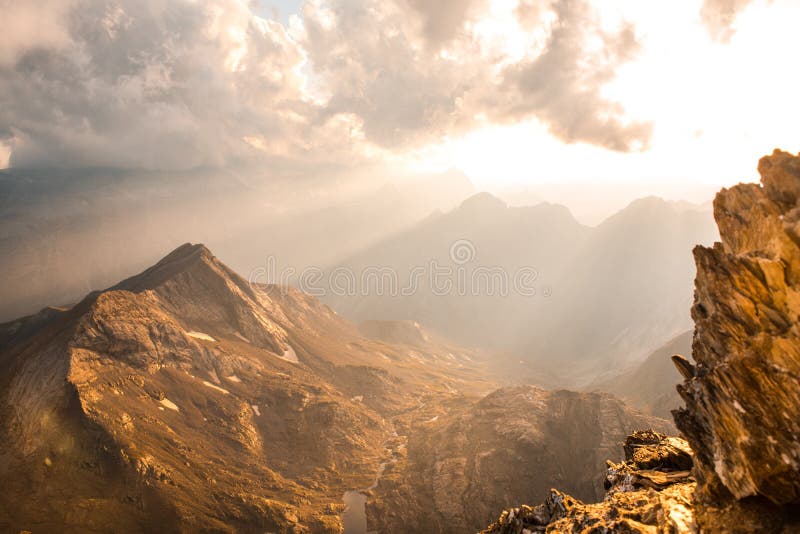 Sunset between Mountains and Clouds Stock Image - Image of colorful ...
