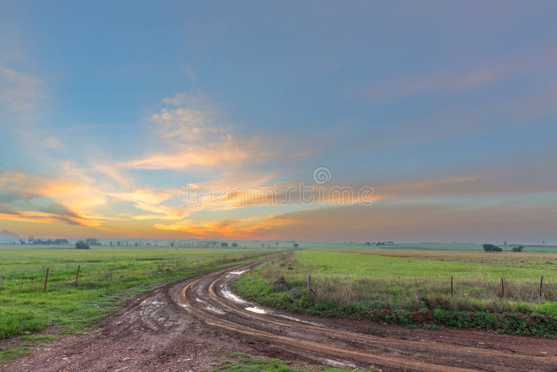 Sunset and a muddy road stock image. Image of maize, farm - 65666533