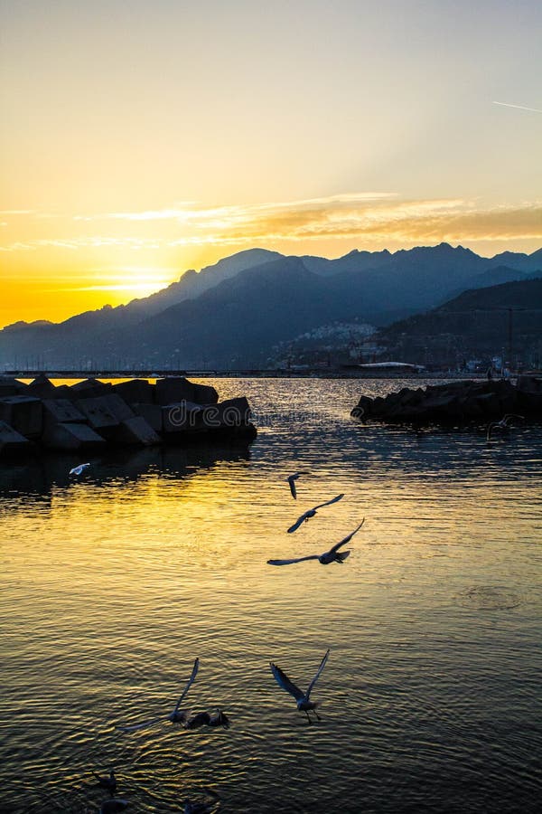 Sunset in Napoli Italy stock photo. Image of coast, boats - 62716240