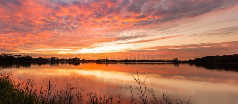 Sunset Nearly Fall from the Sky on the Horizon Reflected into the Water ...