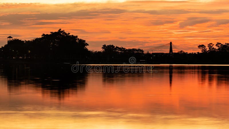 Sunset Nearly Fall from the Sky on the Horizon Reflected into the Water ...