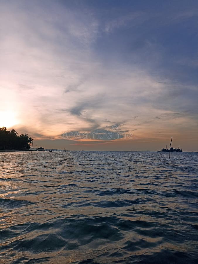 Sunset in nongsa beach stock photo. Image of wonderful - 262402448