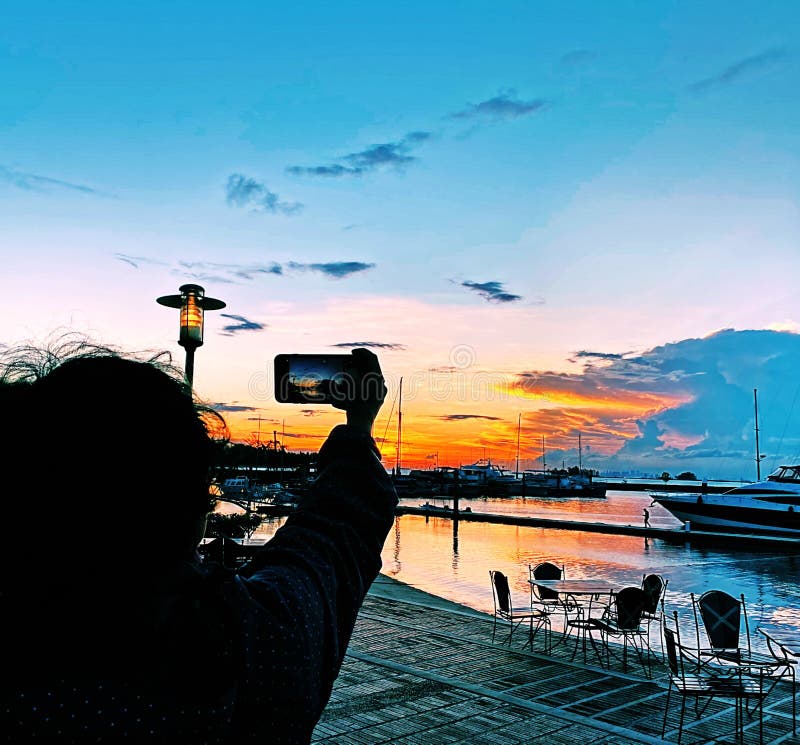 Capturing sunset stock photo. Image of beach, horizon - 261901254