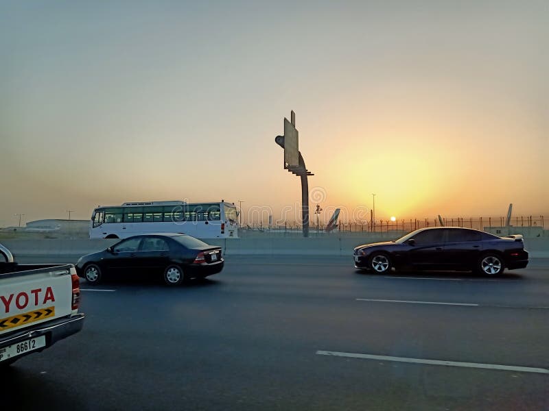 Sunset and the Normal Traffic on the Road Editorial Stock Image - Image ...