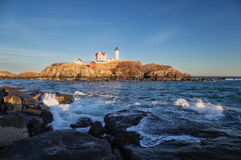 Sunset on Nubble Lighthouse, Maine Stock Image - Image of snowfall ...