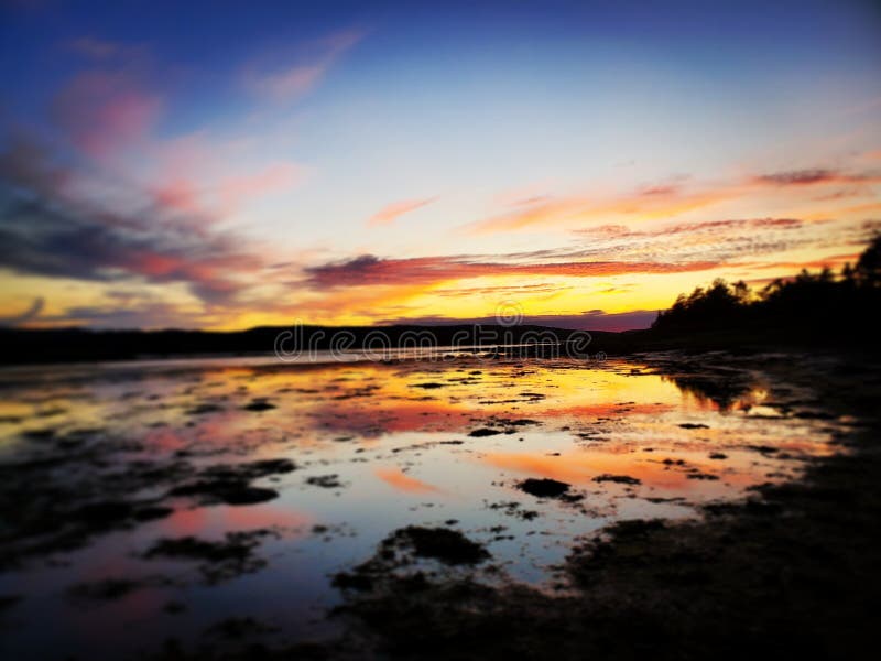 Sunset stock image. Image of ocean, reflection, clouds - 164194243