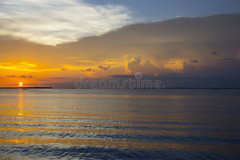 Sunset at the ocean stock photo. Image of largo, romantic - 77092110
