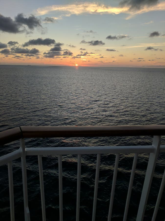 Sunset on the Ocean, with with Railing in Front Stock Image - Image of ...