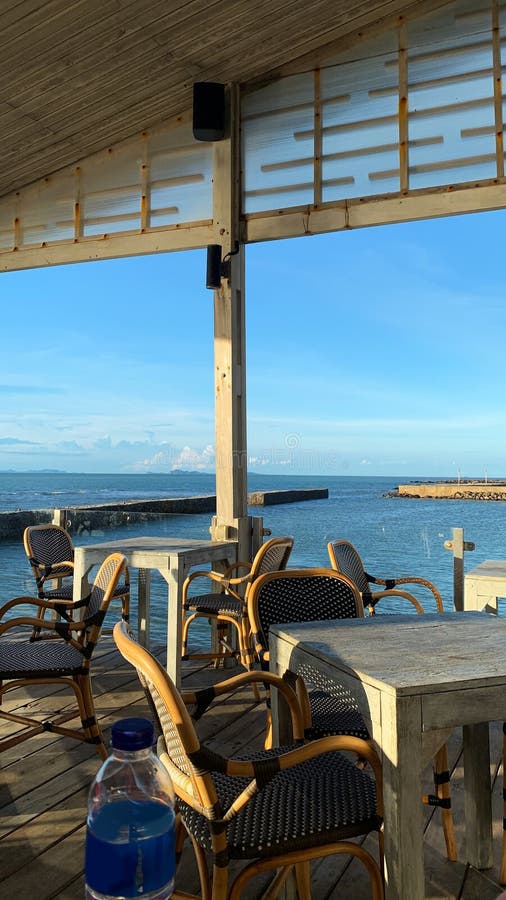 Sunset Ocean View from a Seaside Café with Empty Chairs Stock Image ...