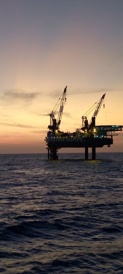 Sunset Oil Rigs stock image. Image of platform, rigs - 261755745