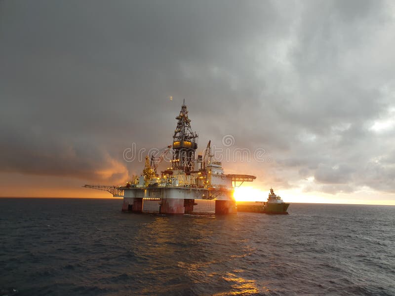 Sunset at oilrig editorial stock photo. Image of sunset - 262153593