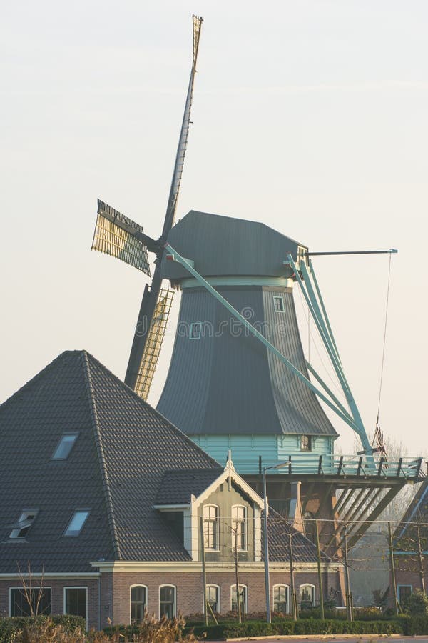 Sunset with Old Dutch Windmill Stock Photo - Image of winter, frozen ...