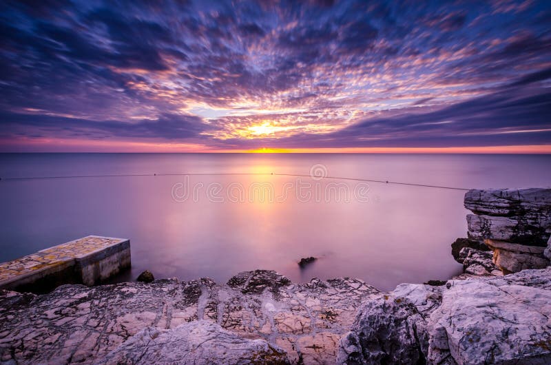 Sunset at the open sea stock image. Image of rock, croatia - 60169689