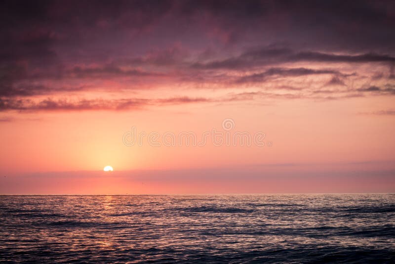Sunset in open sea stock image. Image of open, purple - 83077683