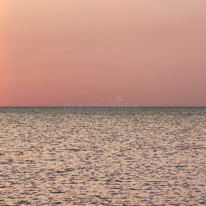 Orange Clear Sky Sunset with Divided Sea Horizon View Stock Photo ...