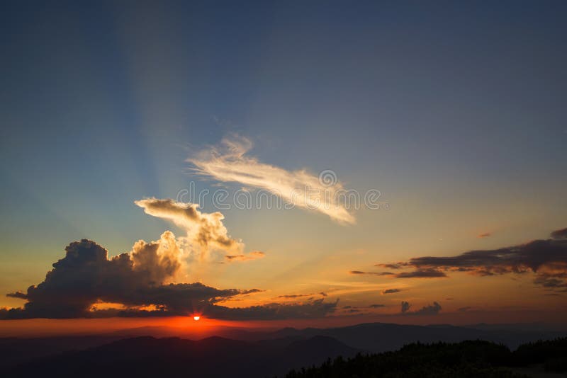Sunset Orange Sun, Rays Over the Mountains Stock Photo - Image of ...