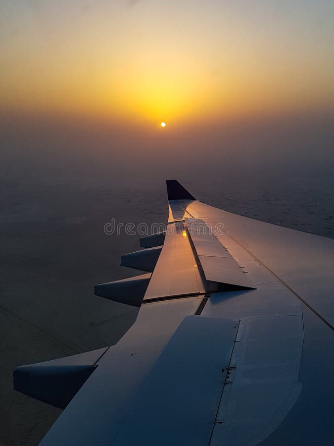 The Sunset Out of an Flying Airplane Window during the Approach at Abu ...