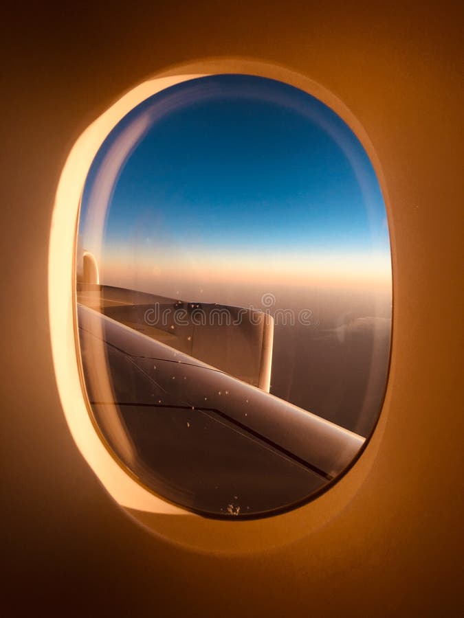 Sunset out of plane window stock image. Image of planewing - 153844717