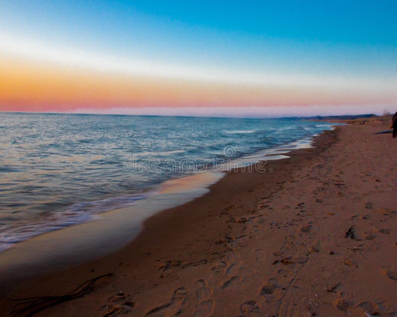 Sunset at Oval Beach Saugatuck Stock Photo - Image of waves, saugatuck ...