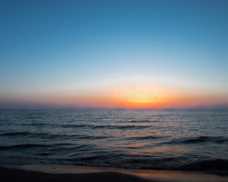 Sunset at Oval Beach Saugatuck Stock Photo - Image of waves, clear ...
