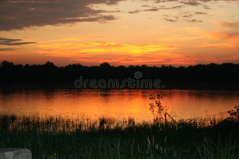 Sunset on an oval lake stock photo. Image of natural, beautiful - 5444902