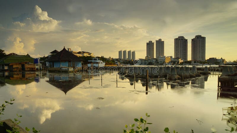 Sunset Over the Apartment Tower in the Mutiara Beach Stock Photo ...