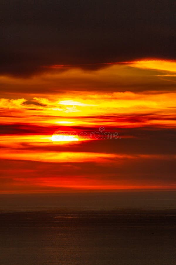 Sunset Over the Ocean. Dramatic Sky and Sun Stock Photo - Image of ...