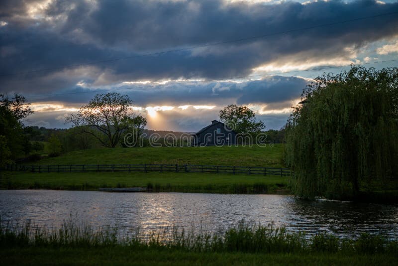 Sunset over the barn stock photo. Image of journey, flower - 91732724