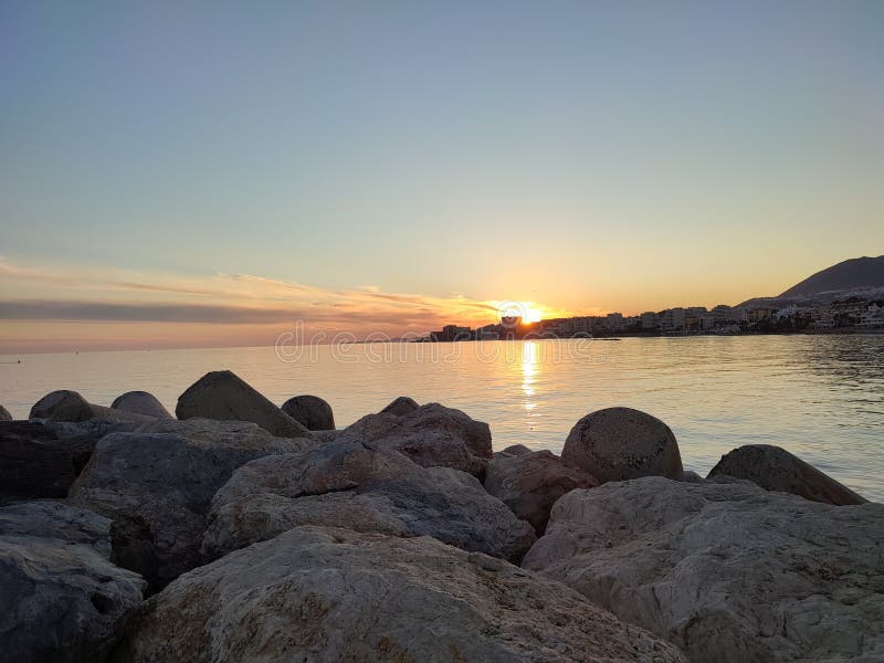 Sunset Over the Bay on the Rock Stock Image - Image of ocean, rock ...