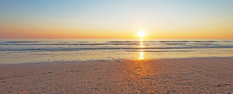 Sunset Over a Beach Along a Sea Stock Image - Image of sunset, leisure ...