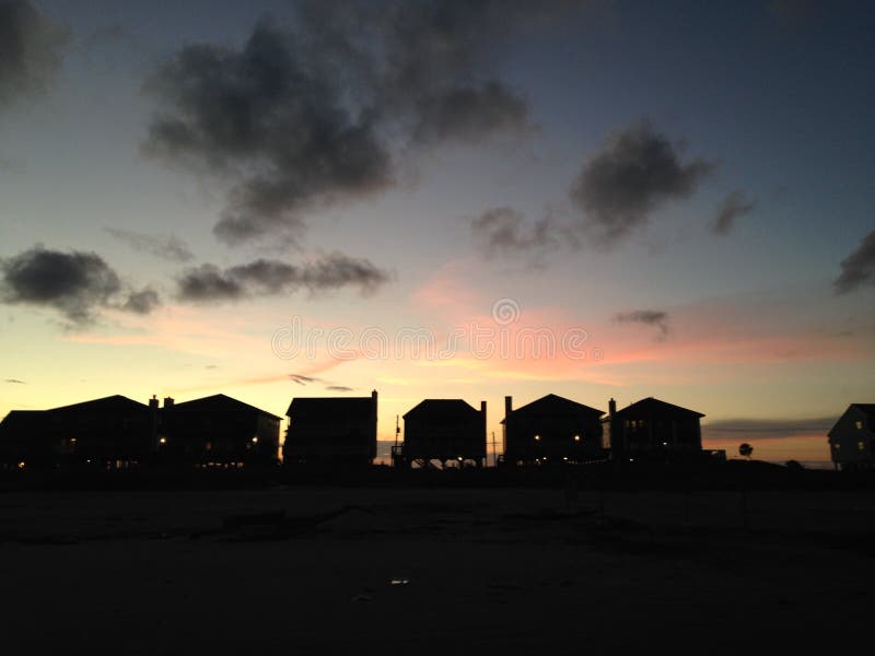 Sunset Over Beach Houses stock image. Image of clouds - 162217297