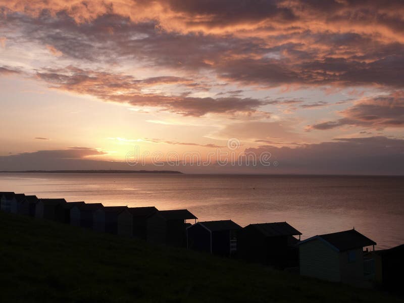 Sunset Over Beach Huts at Whitstable Stock Photo - Image of beach ...