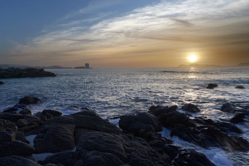 Sunset Over the Beach with Large Rocks Stock Image - Image of ocean ...