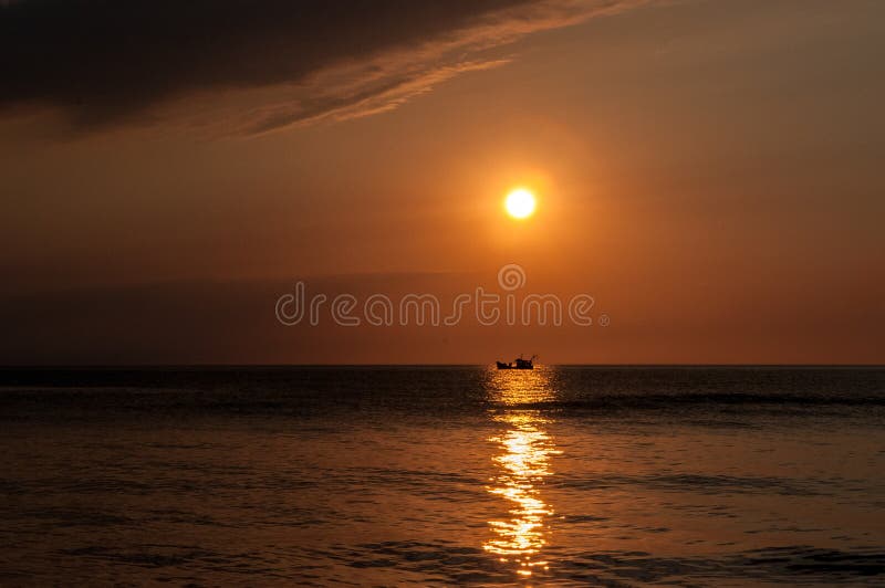Sunset over boat on water stock photo. Image of early - 82995818