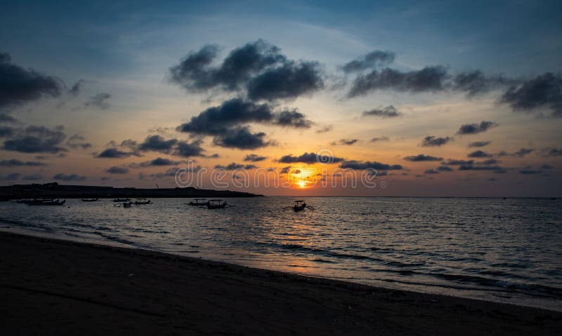 Sunset Over Calm Ocean with Balinese Boat Stock Image - Image of copy ...